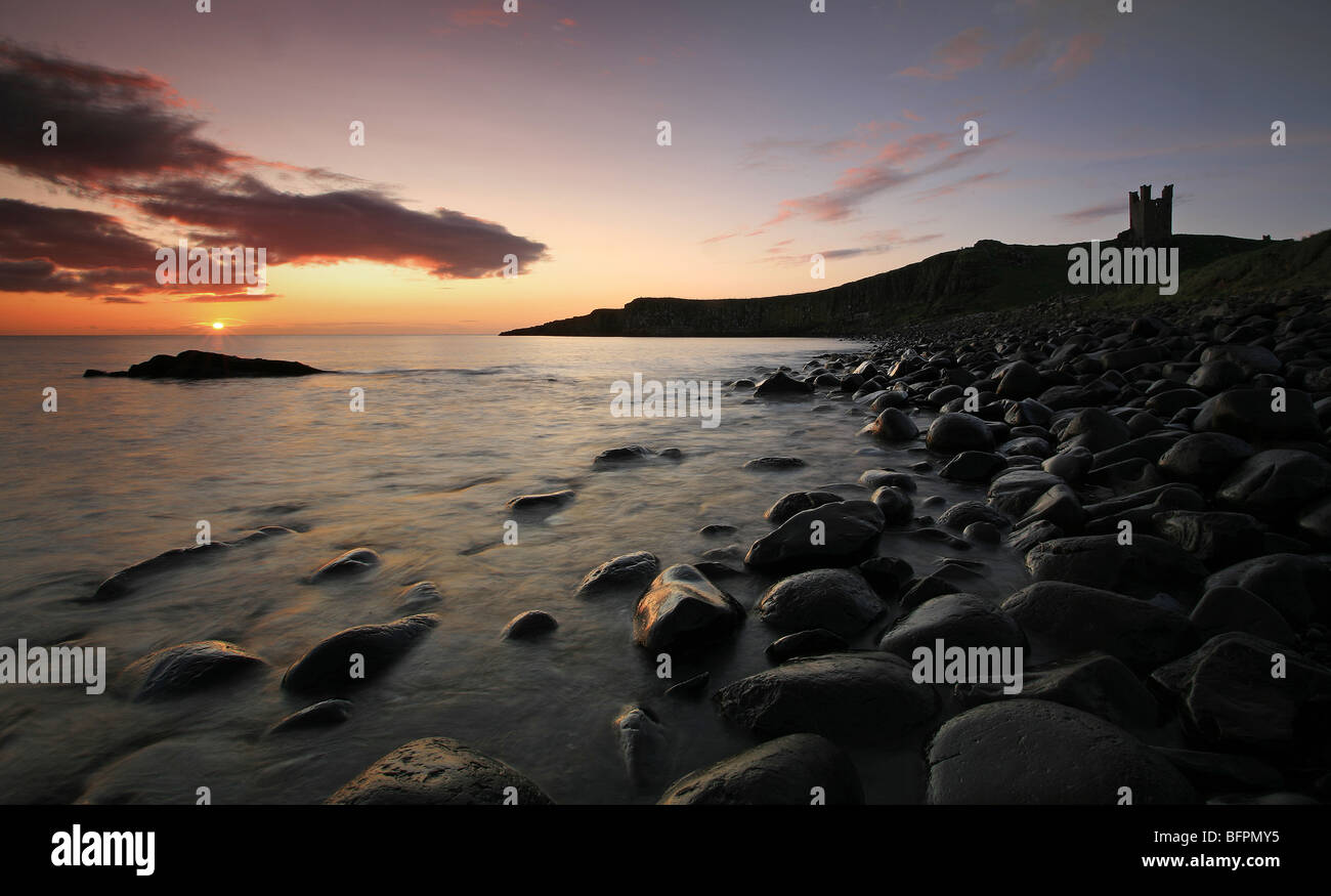 Sunrise at Dunstanburgh Castle, Embleton Bay Stock Photo - Alamy