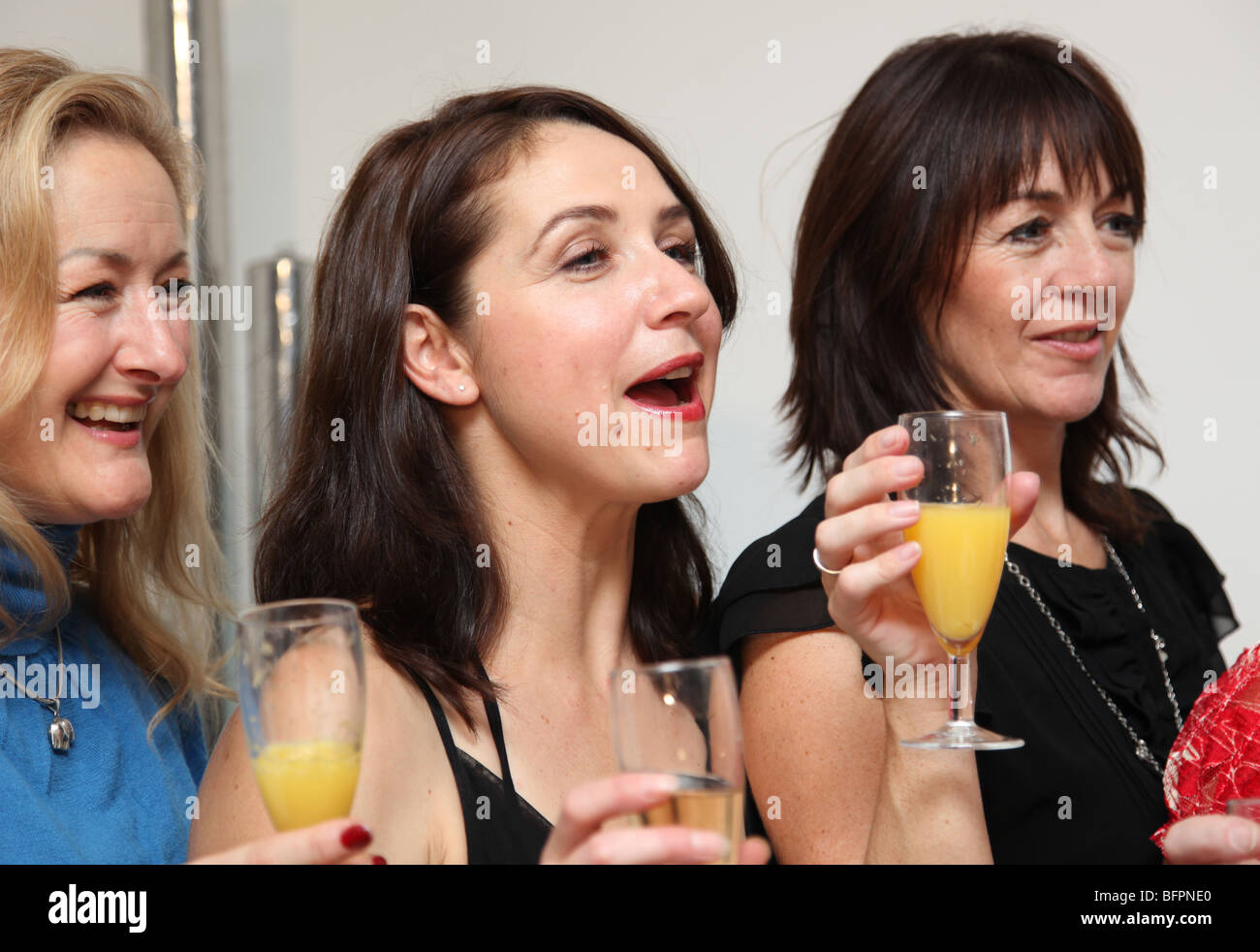 3 ladies celebrating Stock Photo - Alamy