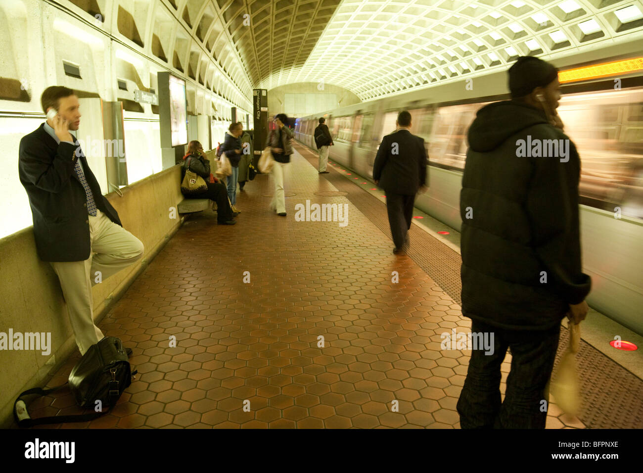 Metro DC; People waiting for a train on the platform, the metrorail or ...