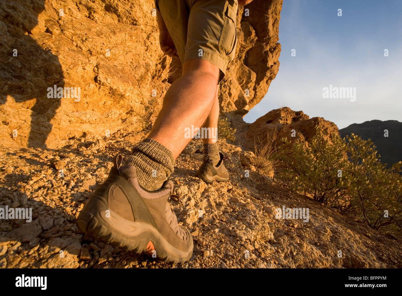 A man working up steep terraine in the southwest Stock Photo - Alamy