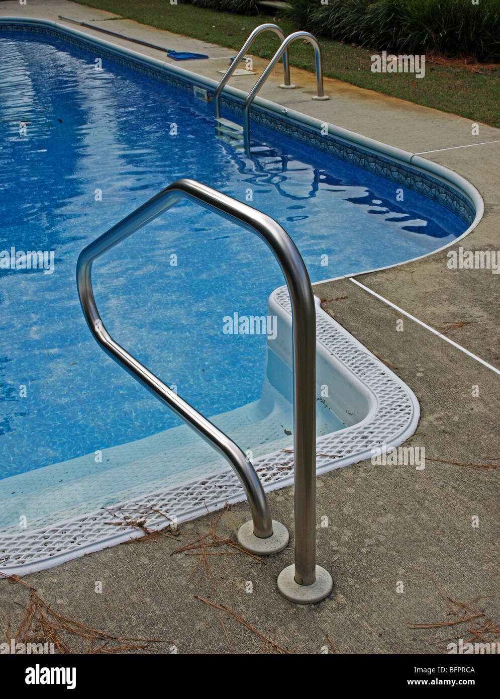 swimming pool partial with large view of safety rail curved metal ...