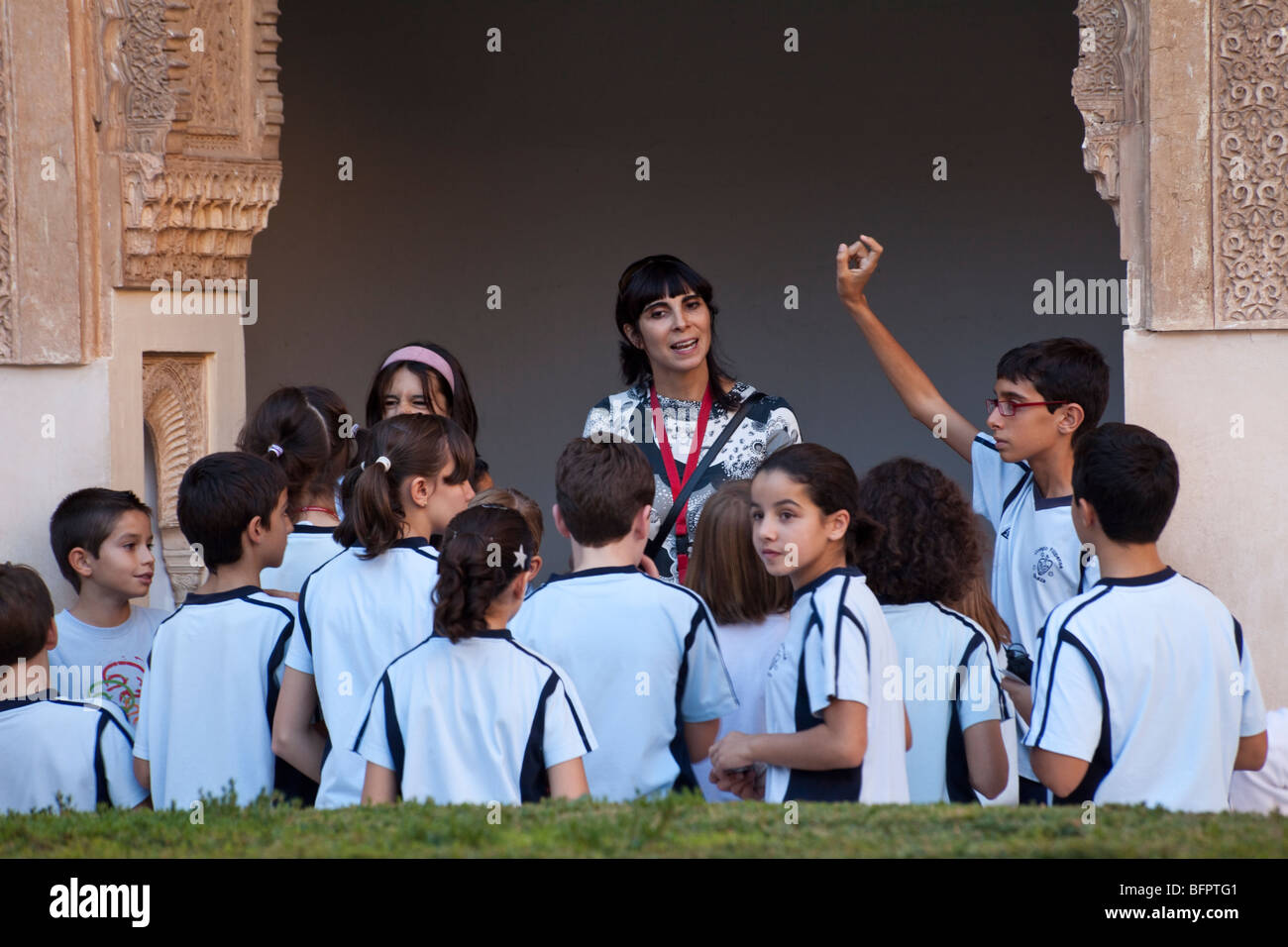 Spanish teacher and school children touring the Court of the Myrtles ...