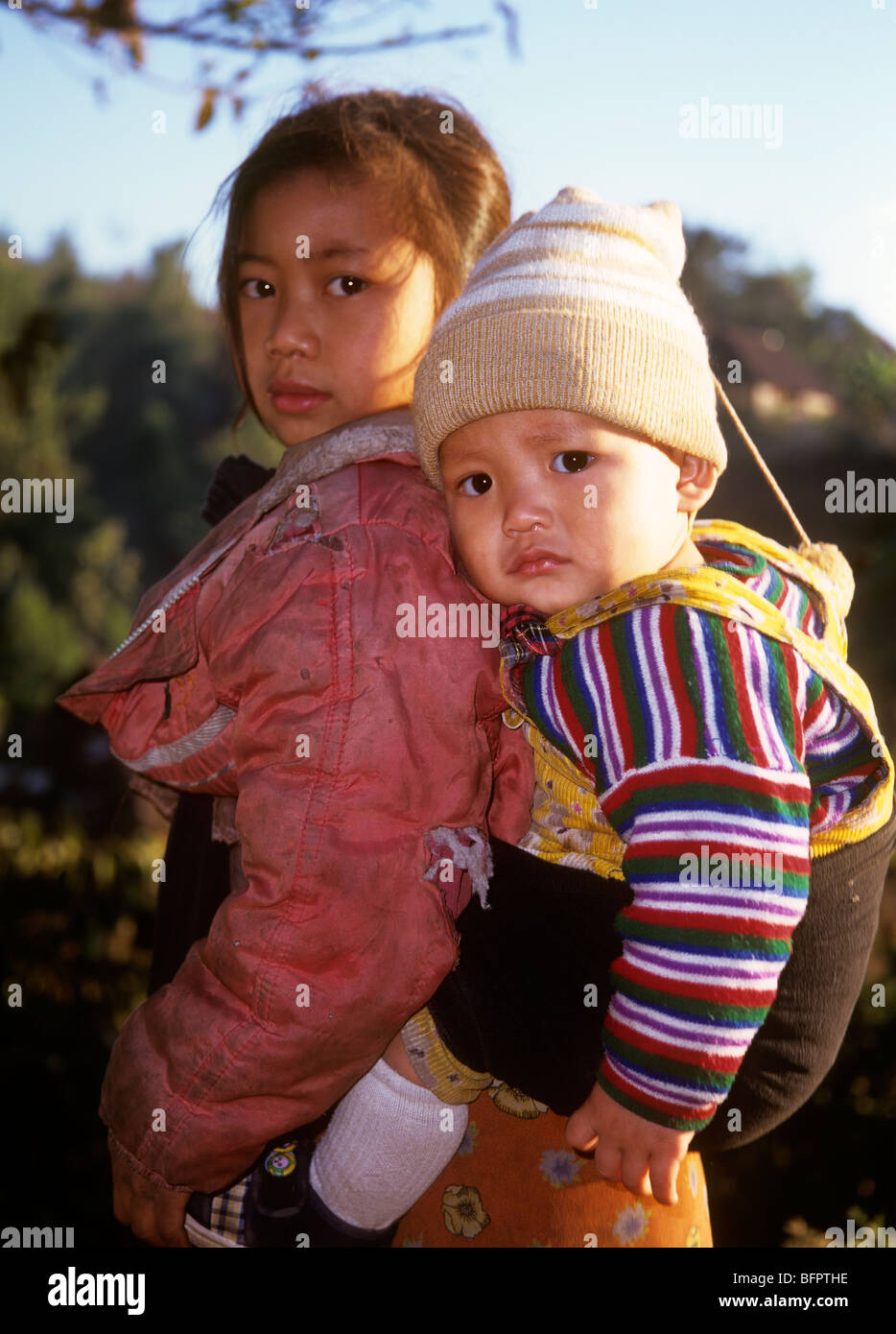 China, Yunnan, South Xishuangbanna, Manbu Dai tribal village, young ...