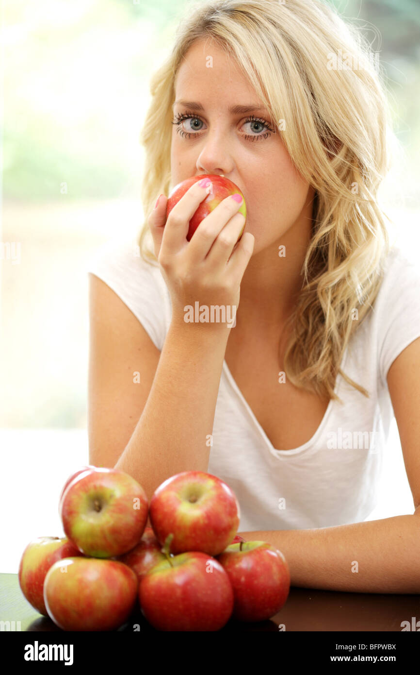 Teenage Girl Eating Apples. Model Released Stock Photo - Alamy