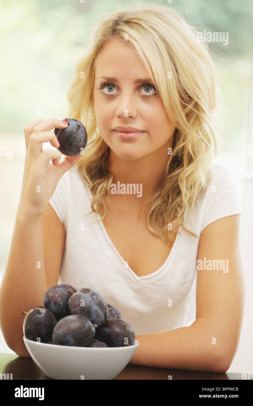 Teenage Girl Eating Plums. Model Released Stock Photo - Alamy