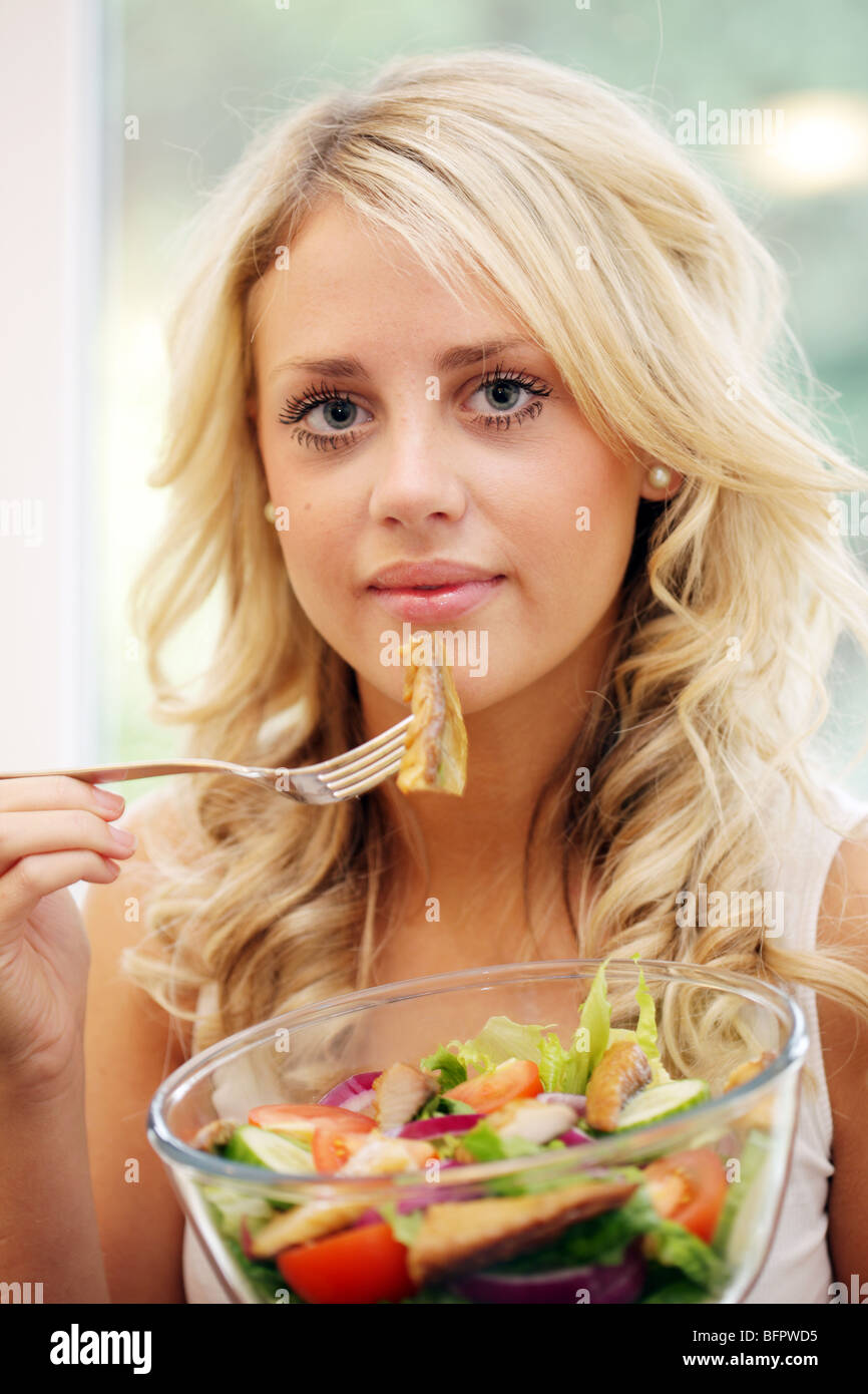 Teenage Girl Eating A Mackerel Salad. Model Released Stock Photo - Alamy