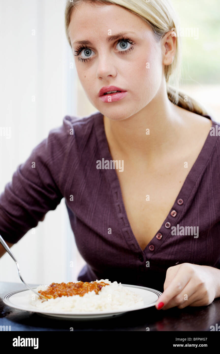 Teenage Girl Eating Chilli Con Carne and Rice. Model Released Stock ...