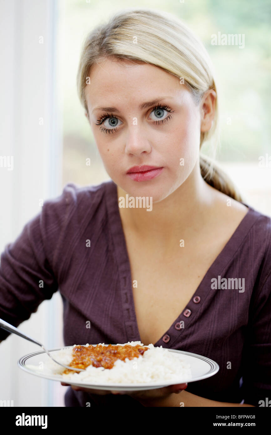 Teenage Girl Eating Chilli Con Carne and Rice. Model Released Stock ...