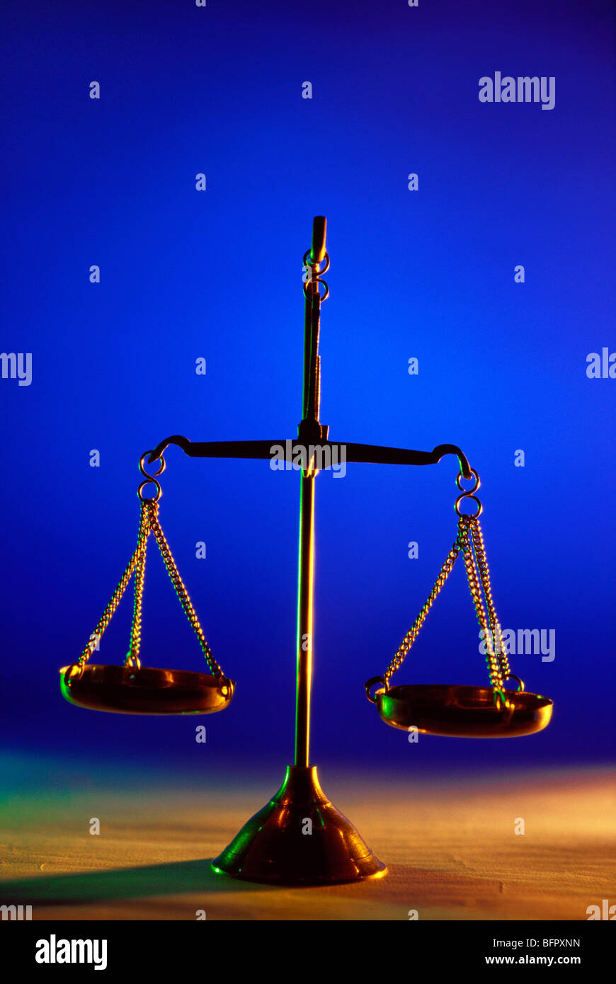 balance weight scale against blue background Stock Photo - Alamy