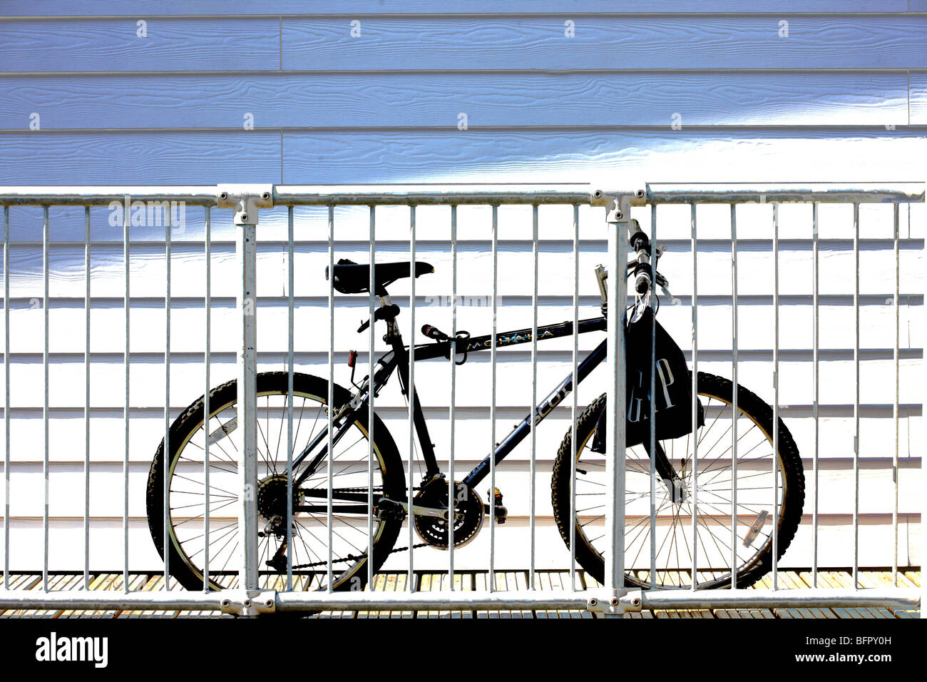 Bike leaning against railings hi-res stock photography and images - Alamy