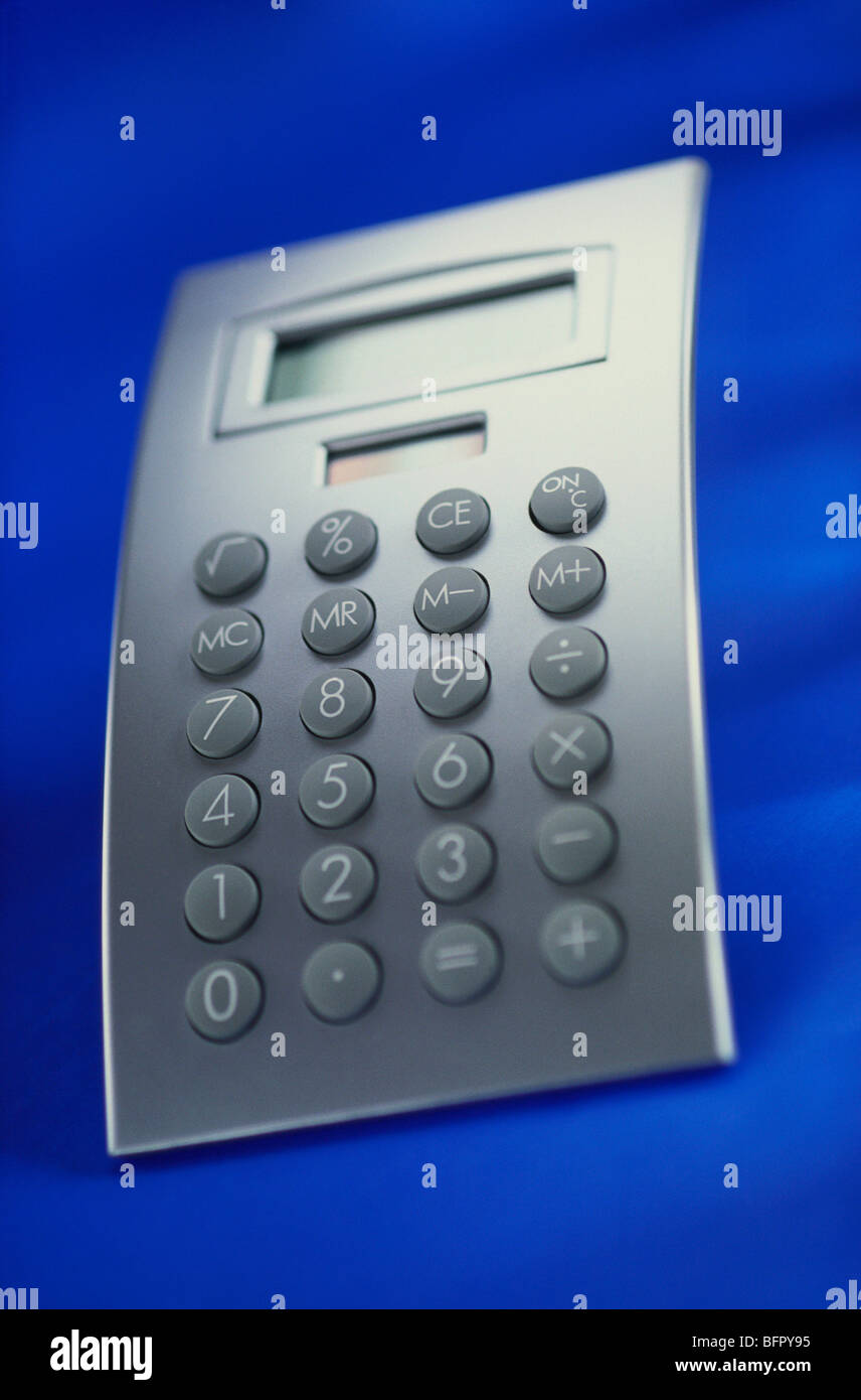 Calculator on blue background Stock Photo - Alamy