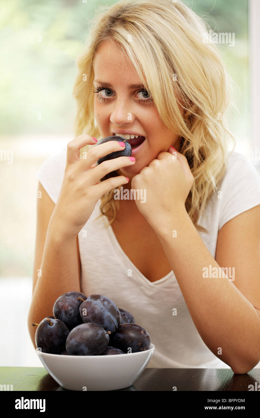 Teenage Girl Eating Plums. Model Released Stock Photo - Alamy