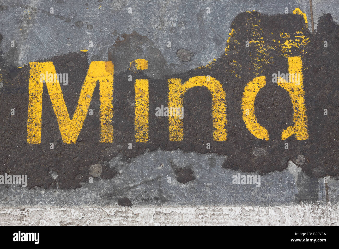 Mind the word Mind painted on a railway platform Stock Photo - Alamy