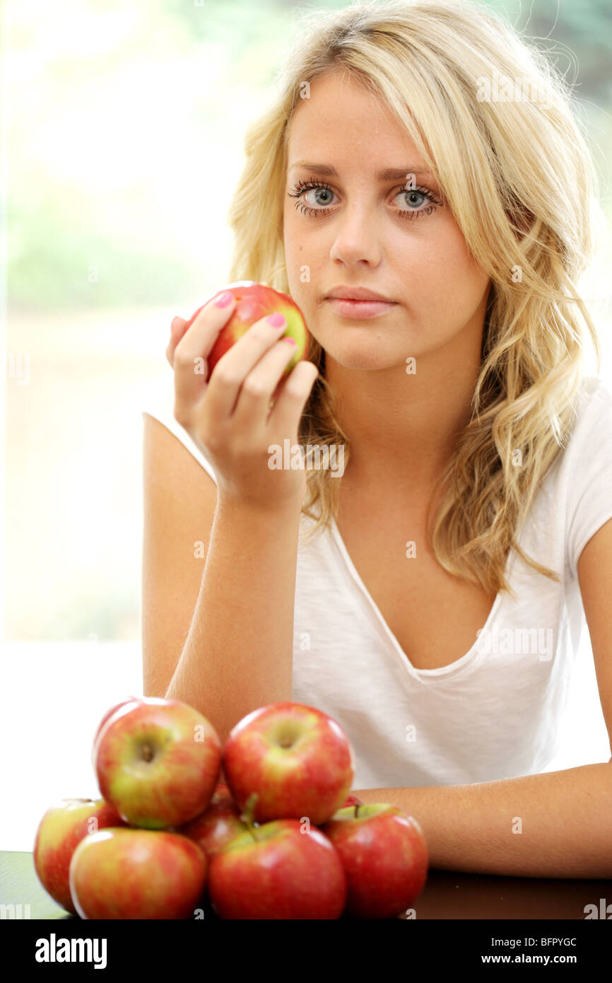 Teenage Girl Eating Apples. Model Released Stock Photo - Alamy