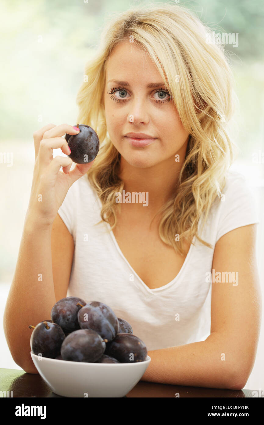 Teenage Girl Eating Plums. Model Released Stock Photo - Alamy