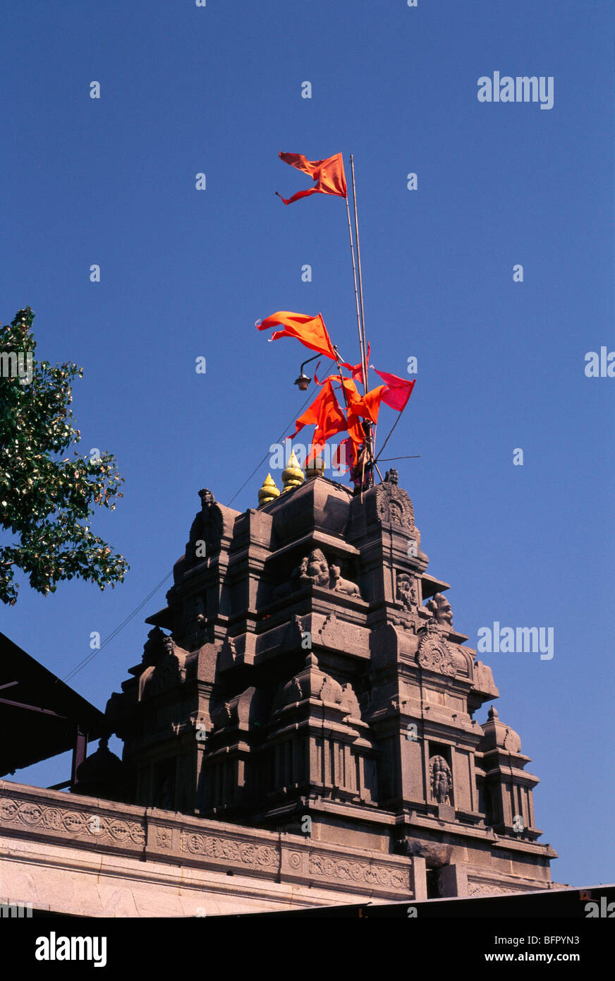 NMK 66812 : Flags and stone carved pinnacle of Datta temple Gangapur ...
