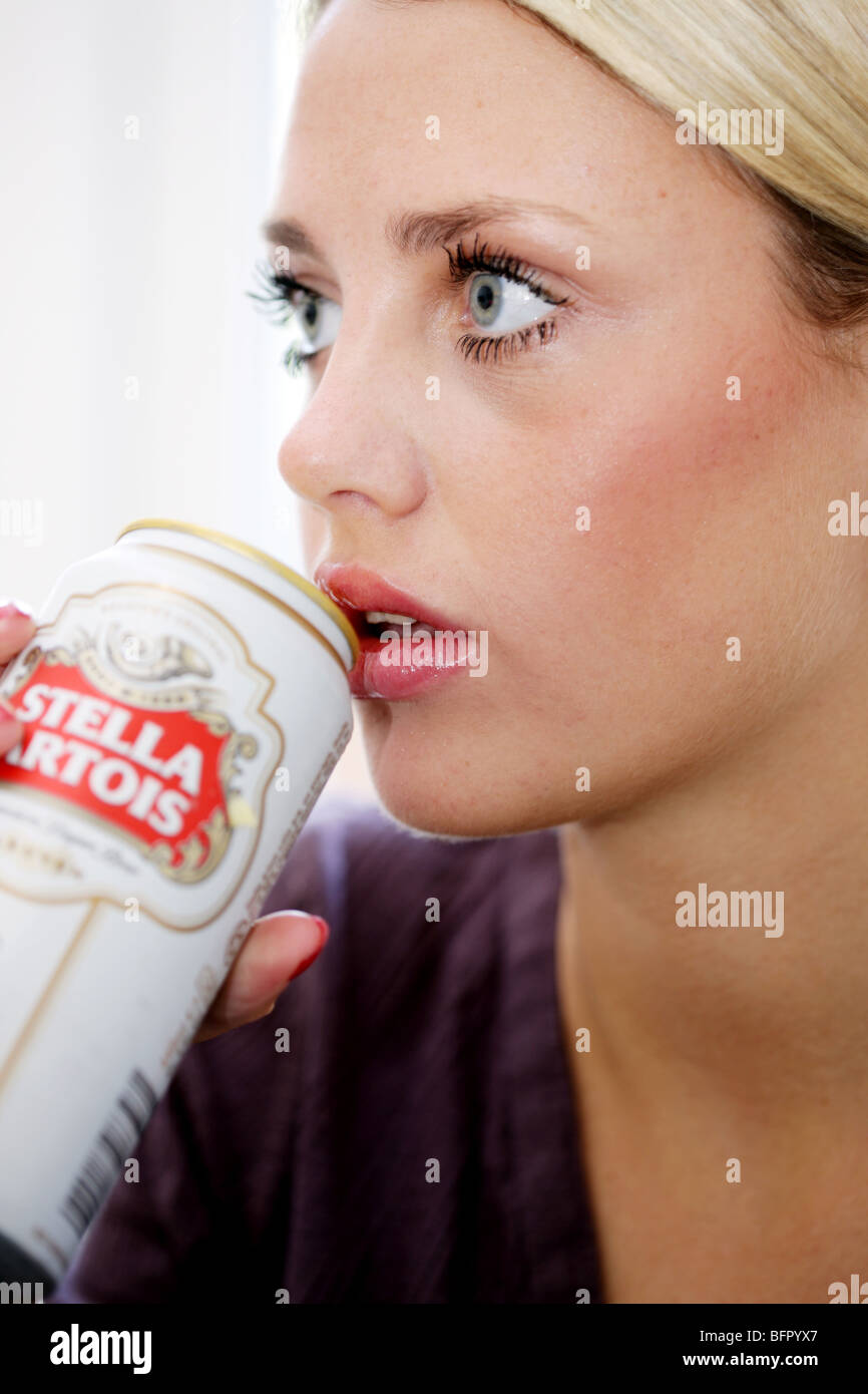 Woman drinking can of beer hi-res stock photography and images - Alamy