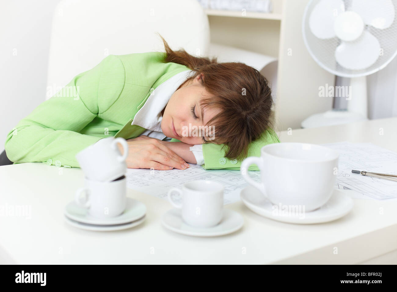Office worker has fallen asleep on work despite drunk by coffee Stock ...