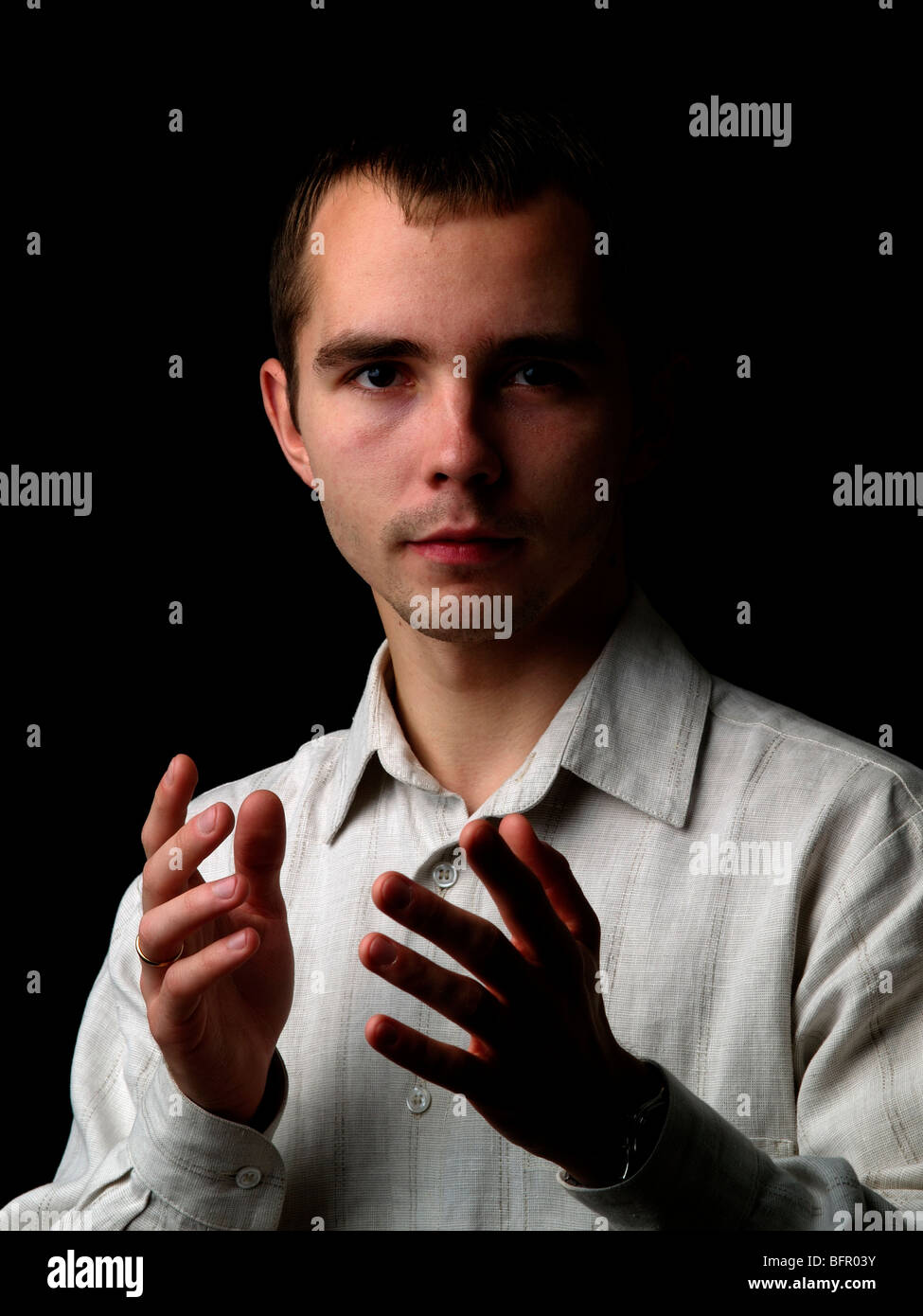 Young man explaining something black background isolated Stock Photo ...