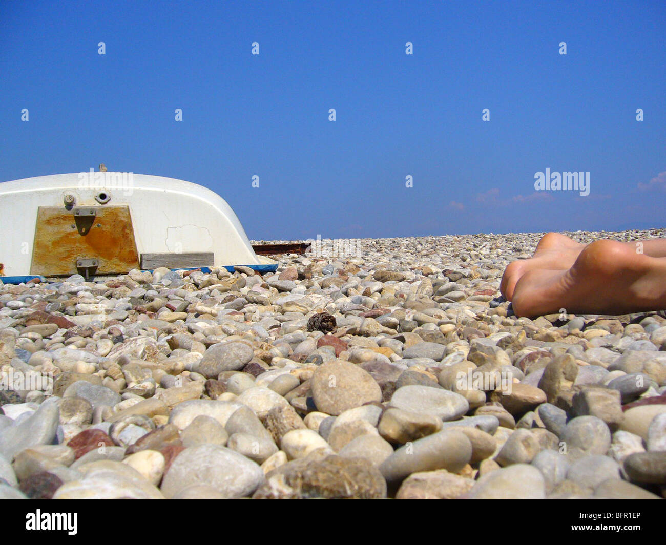 Pebble beach at a Greek resort in northern Peloponnese Stock Photo - Alamy