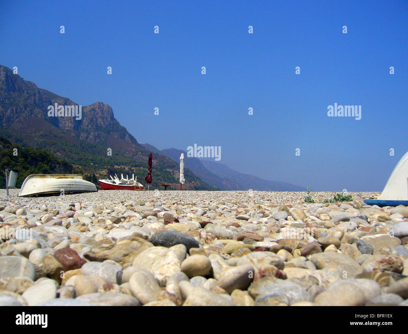 Pebble beach at a Greek resort in northern Peloponnese Stock Photo - Alamy