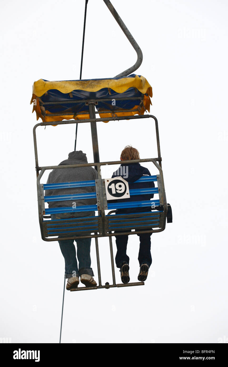Two persons riding a cable car ride at Pleasurewood Hills Stock Photo ...