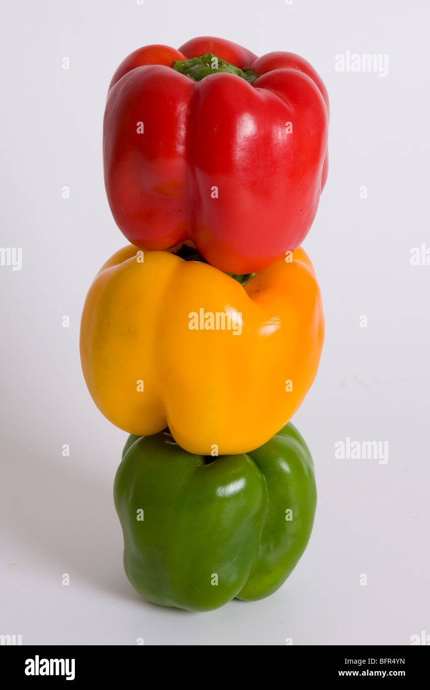 Green yellow and red peppers form a tower Stock Photo - Alamy