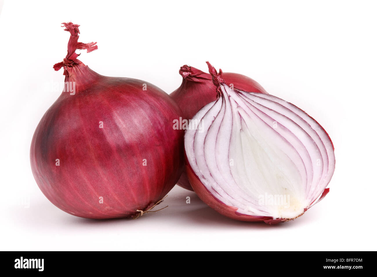 Red onions one sliced against white background Stock Photo - Alamy