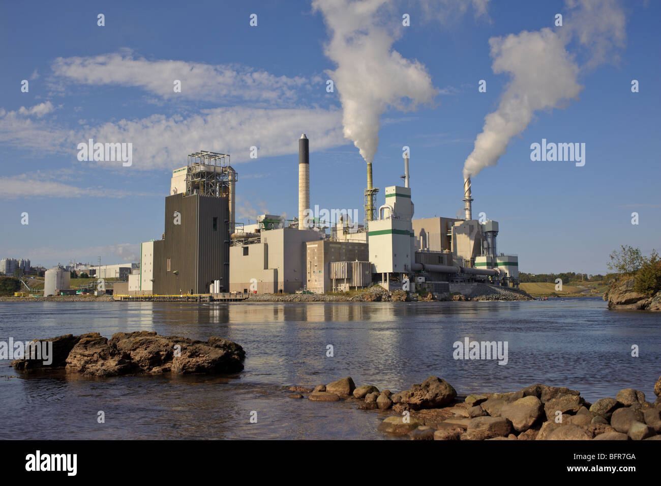 Irving Pulp and Paper mill with reversing falls flowing by on the Saint ...