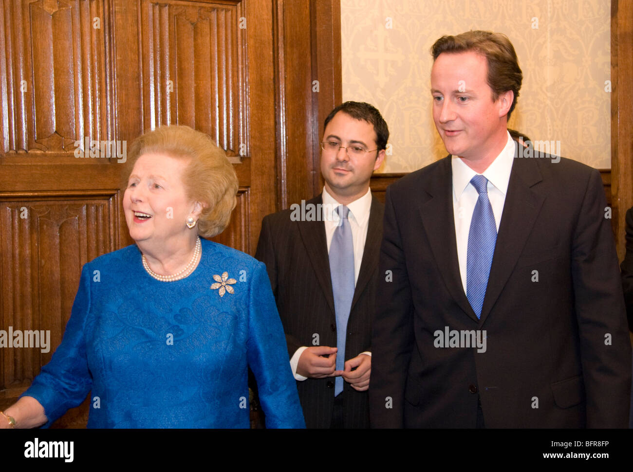 David Cameron introducing Lady Thatcher to a person off camera during a ...