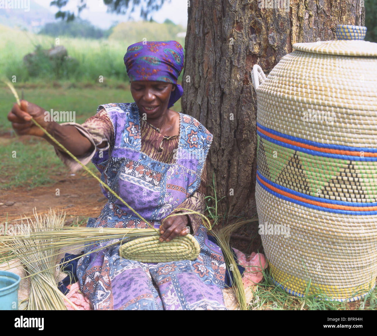 Woman weaving a basket Stock Photo - Alamy