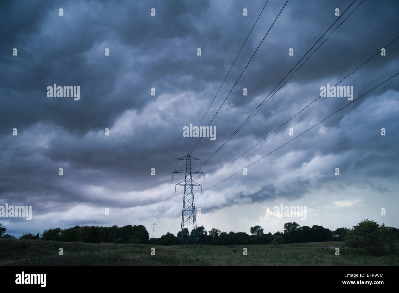 Storm clouds and power pylons, Kent, UK Stock Photo - Alamy