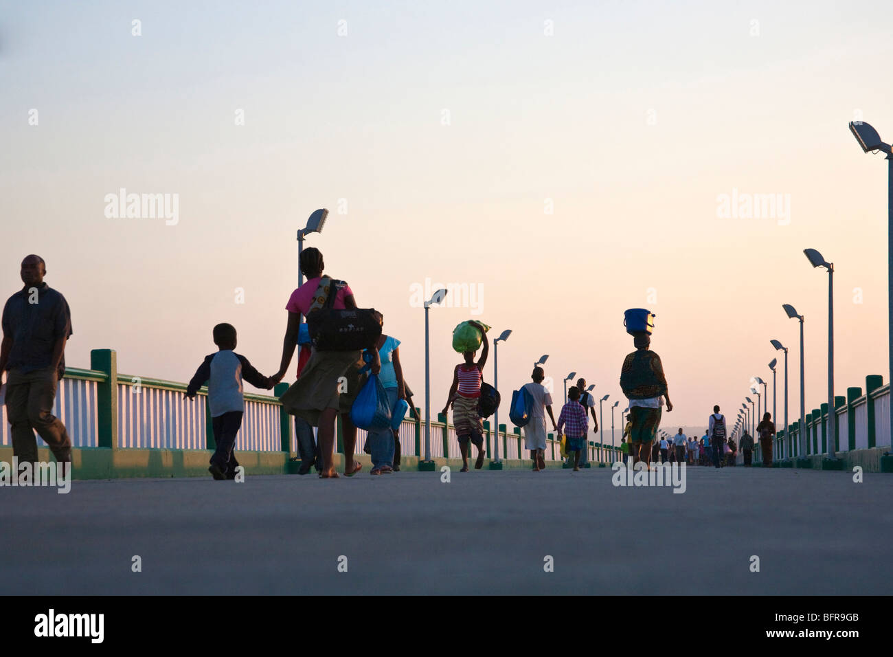 People crossing a bridge Stock Photo - Alamy