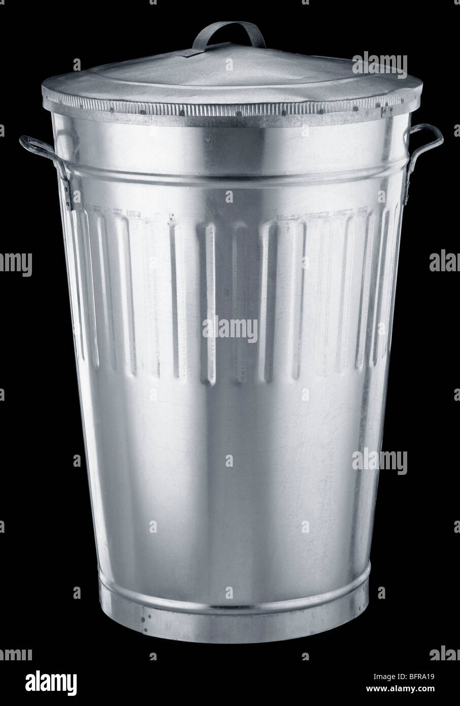 Metal garbage can isolated on a black background Stock Photo - Alamy