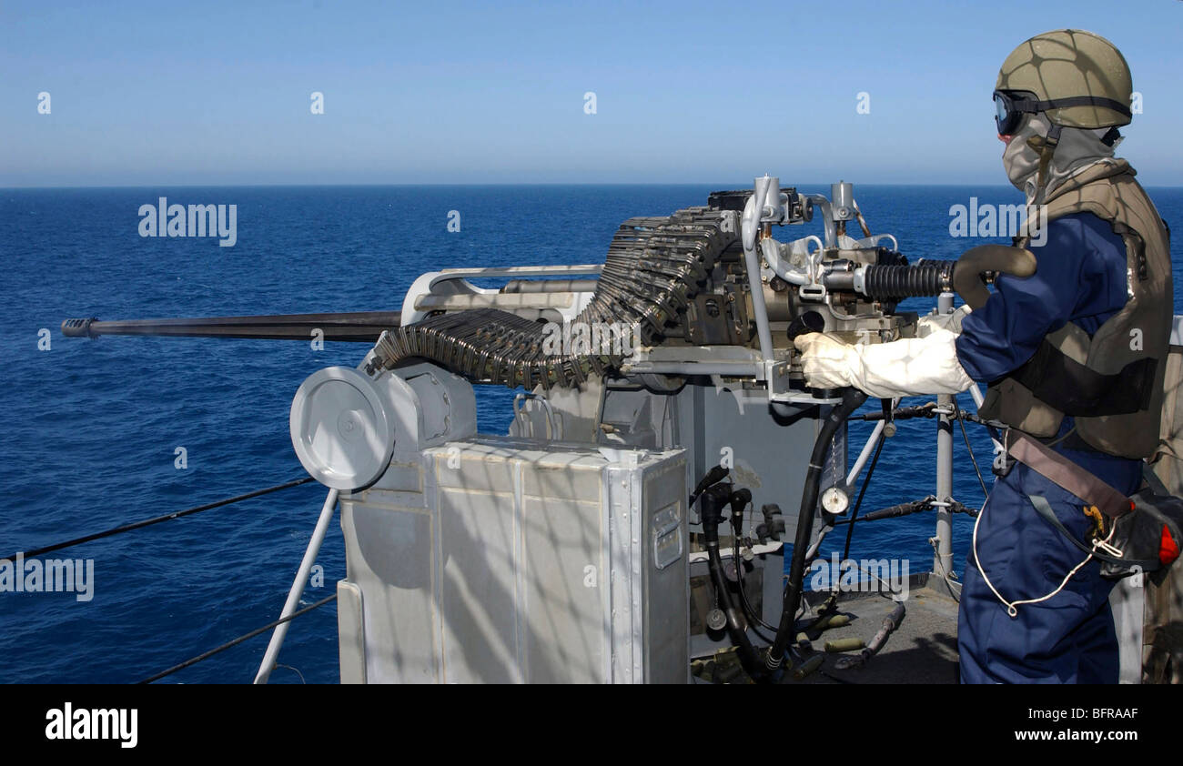 July 13, 2007 - U.S. Navy Gunner's Mate fires a .50-caliber machine gun ...