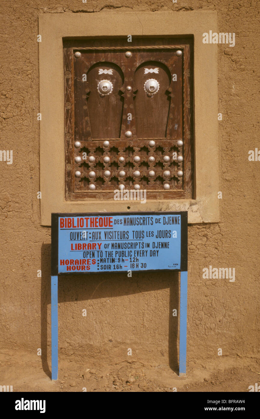 Signboard outside Djenne library with typical carved window design in ...