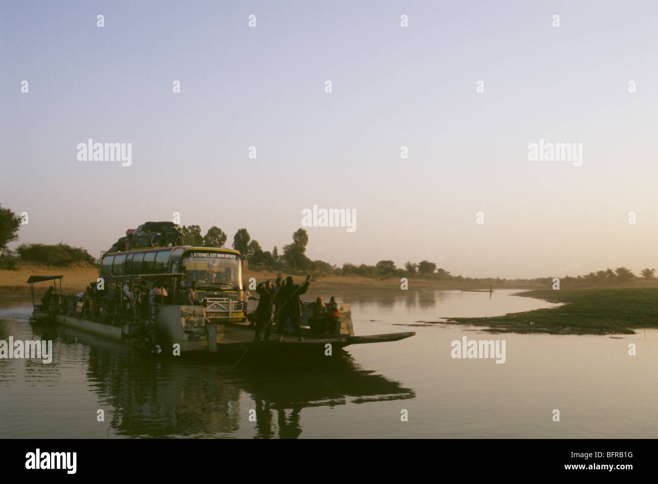 Ferry transporting bus tributary of the Niger River Stock Photo - Alamy