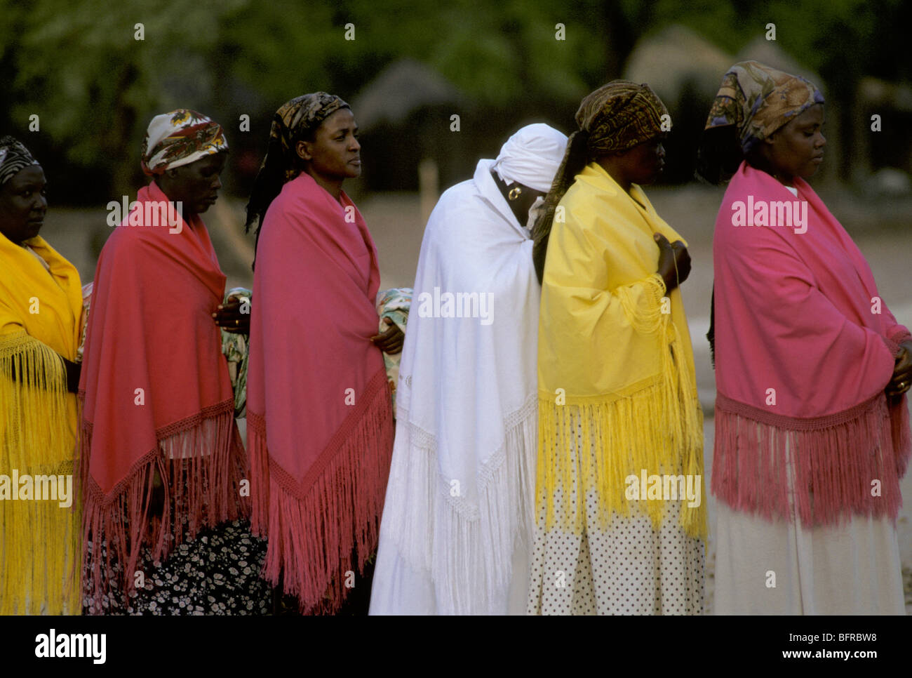 Bayei wedding procession with the bride dressed in white Stock Photo ...