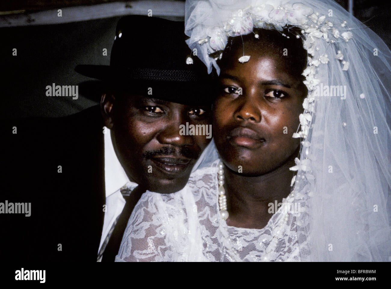 Portrait of a Bayei couple from Maun posing in their wedding outfits ...