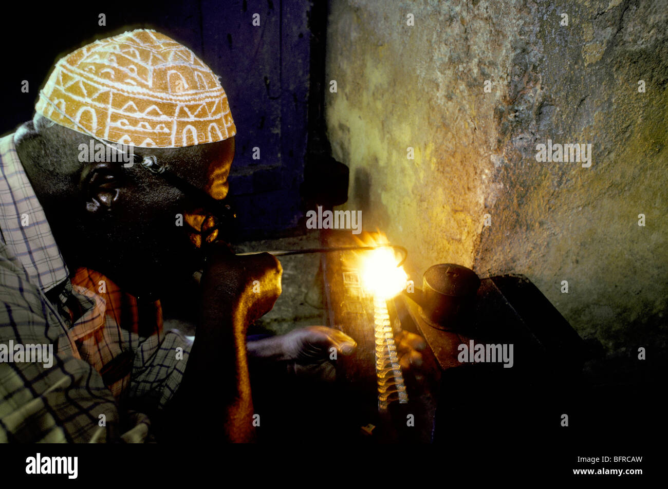 Silversmith soldering bracelet Stock Photo - Alamy