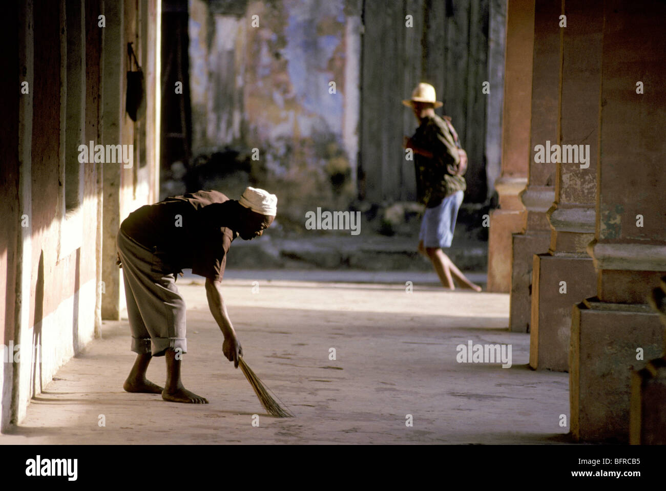 Man sweeping black hi-res stock photography and images - Alamy