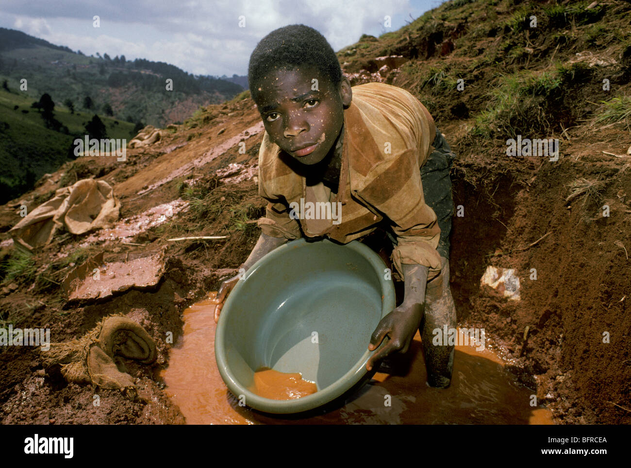 Young boy panning for gold Mimosa mining area Stock Photo - Alamy
