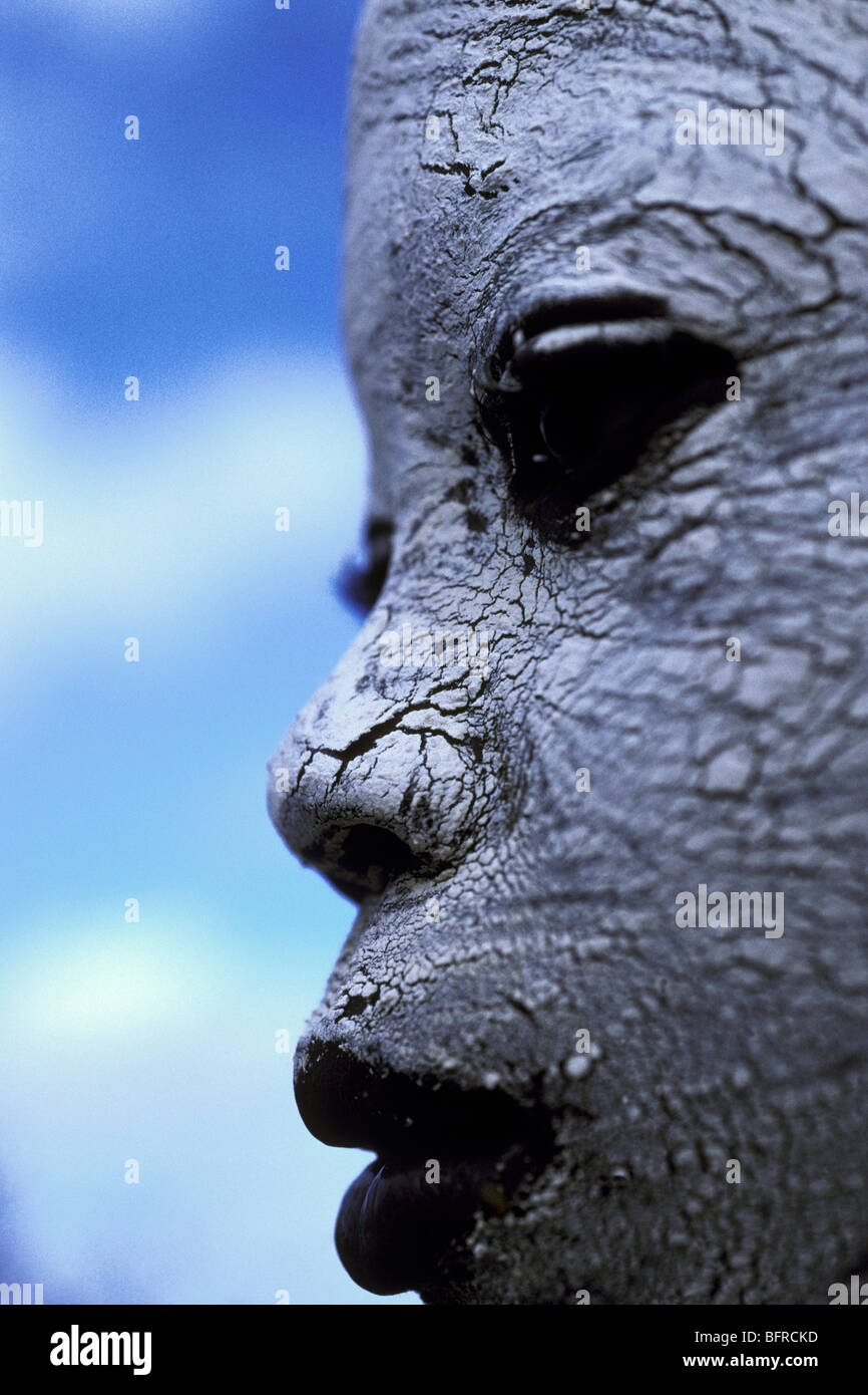 Makua girl wearing muciro root face mask Stock Photo - Alamy
