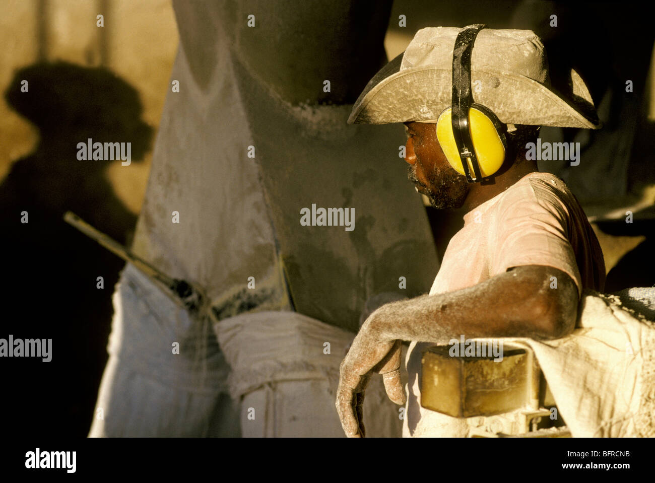 Man grinding corn in hammer mill Stock Photo - Alamy