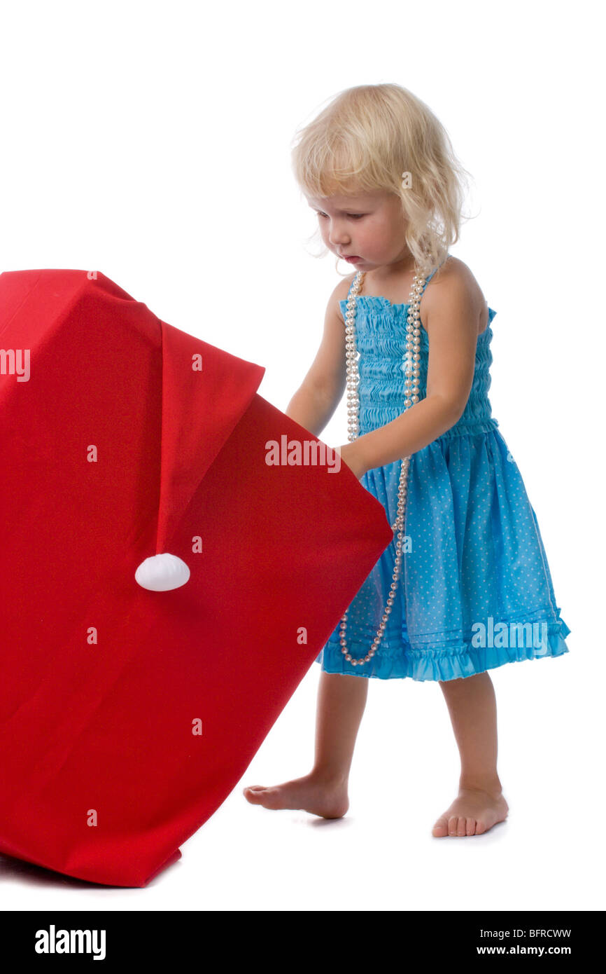 the little girl gets gifts from the big red box Stock Photo - Alamy
