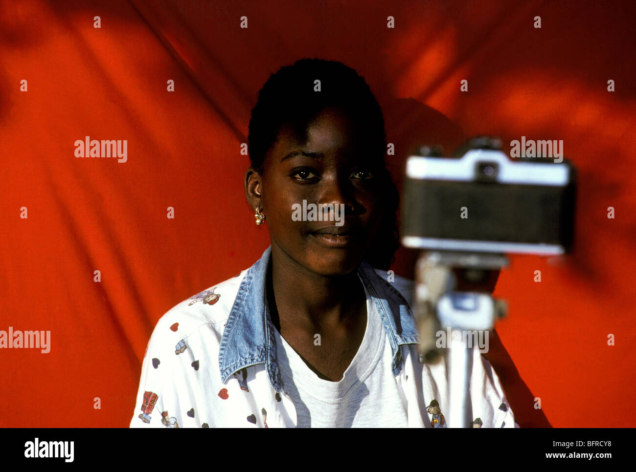 Nilsa pedro Langa photographer waits for clients Stock Photo - Alamy