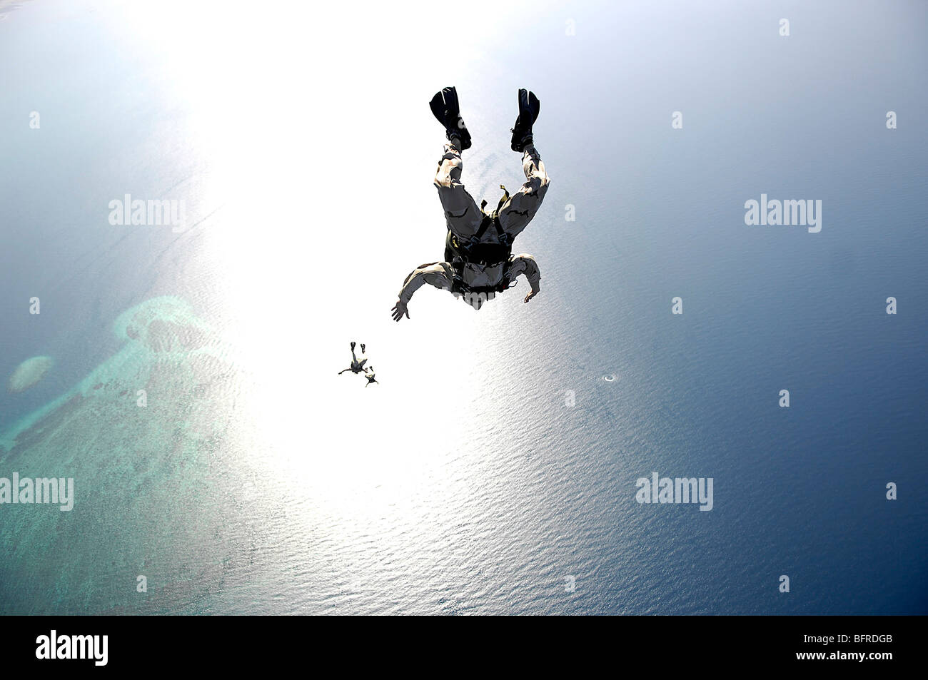 U.S. Air Force pararescuemen conducting a pararescue training jump from ...
