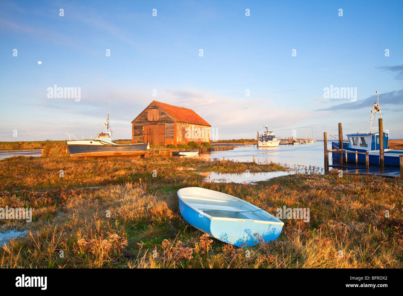 The flooded salt marshes and boat house/former coal shed at high tide ...