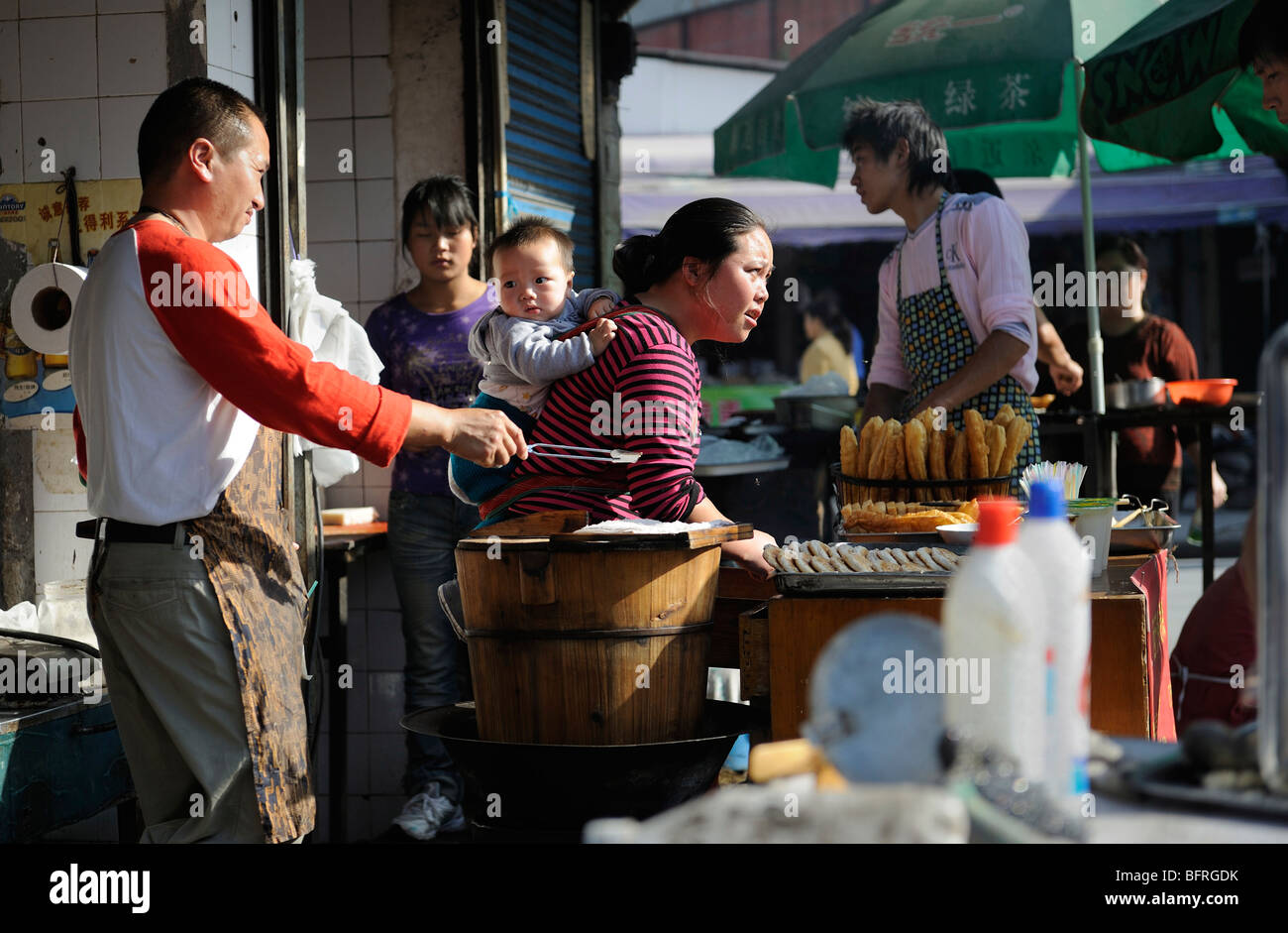 Chinese woman baby on back hi-res stock photography and images - Alamy
