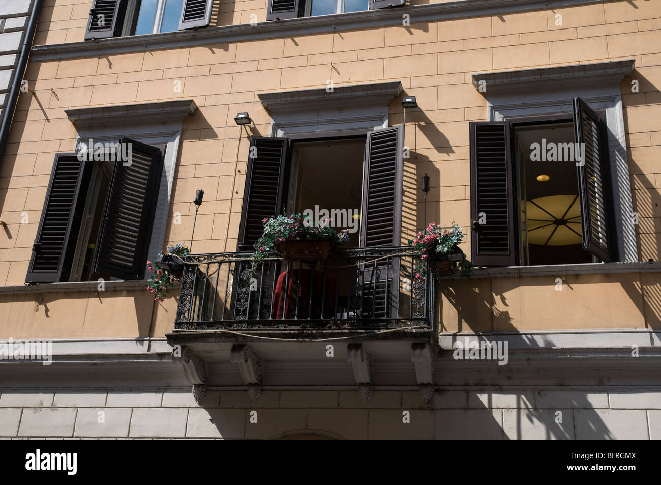 Italian house with balcony decorated with flowers Stock Photo - Alamy